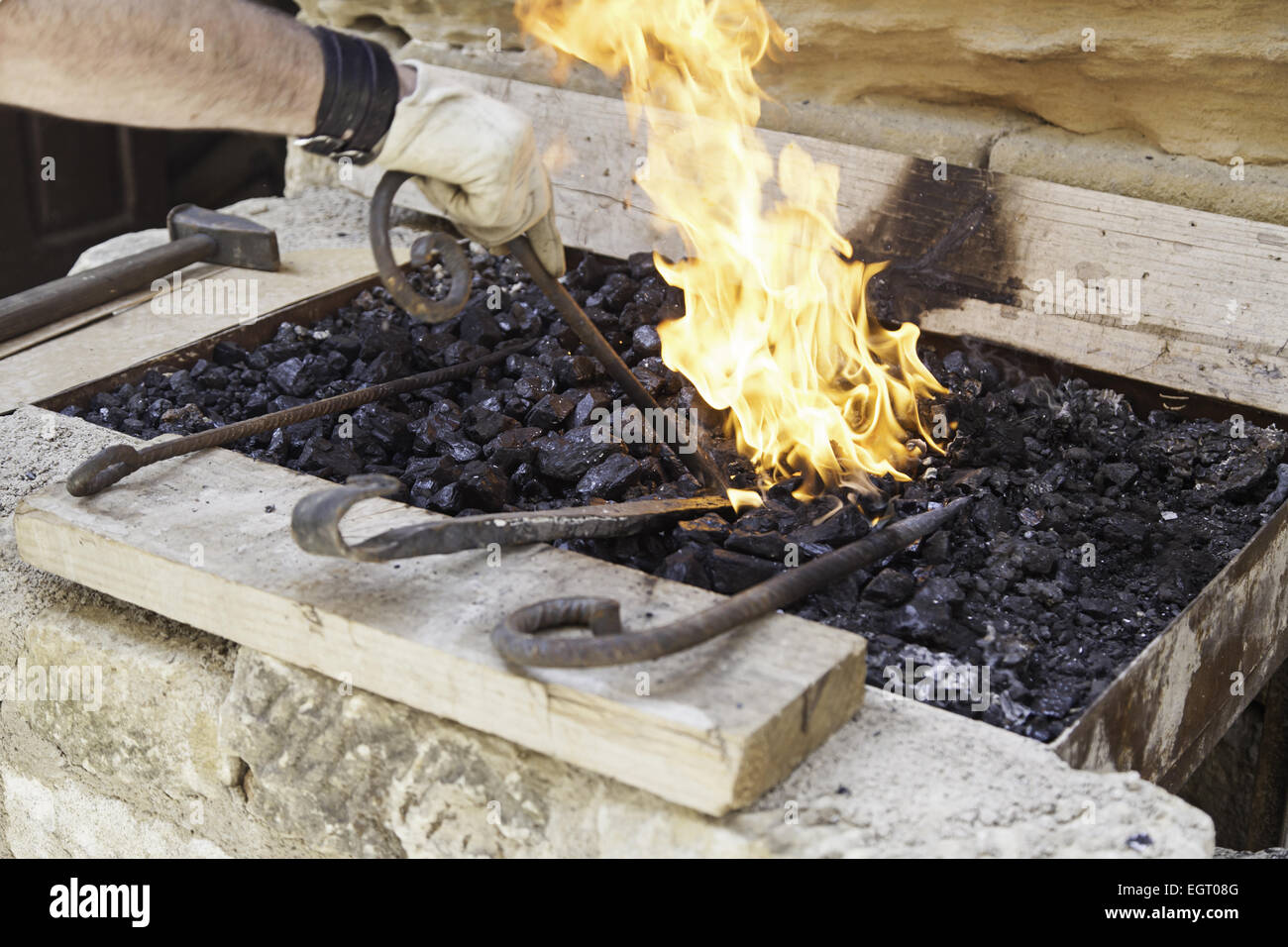 Flames in a forge, a forge detail for shaping metals, craftsmanship ...