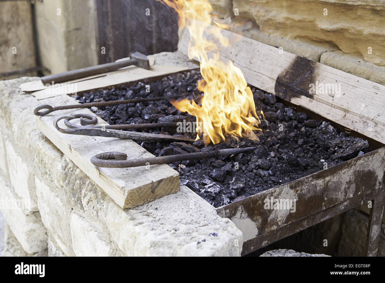 Flames in a forge, a forge detail for shaping metals, craftsmanship ...