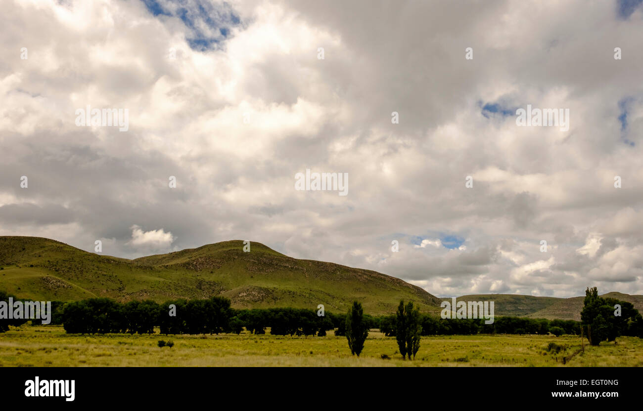 Green mountain under storm clouds Stock Photo - Alamy