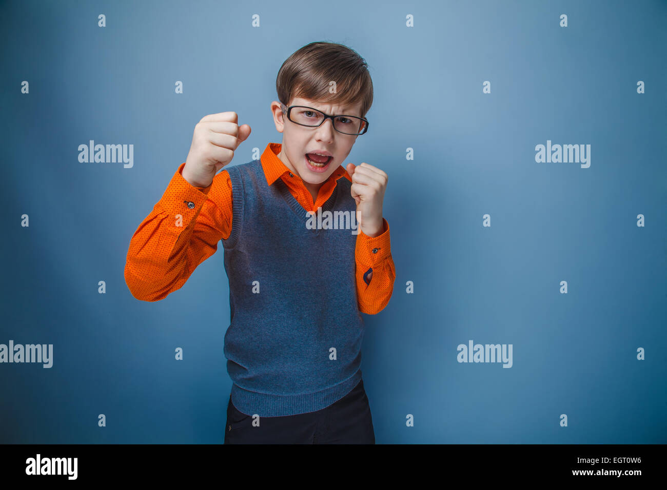 European-looking boy of ten years in glasses, anger, opened his Stock ...
