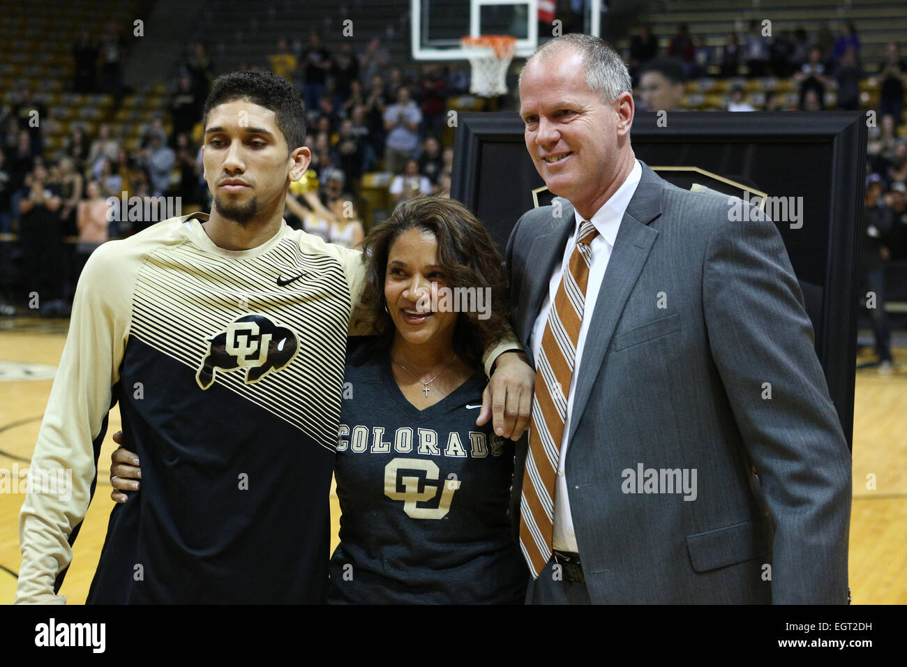 Boulder. 1st Mar, 2015. Colorado guard Askia Booker poses with his mother and head coach Tad ...