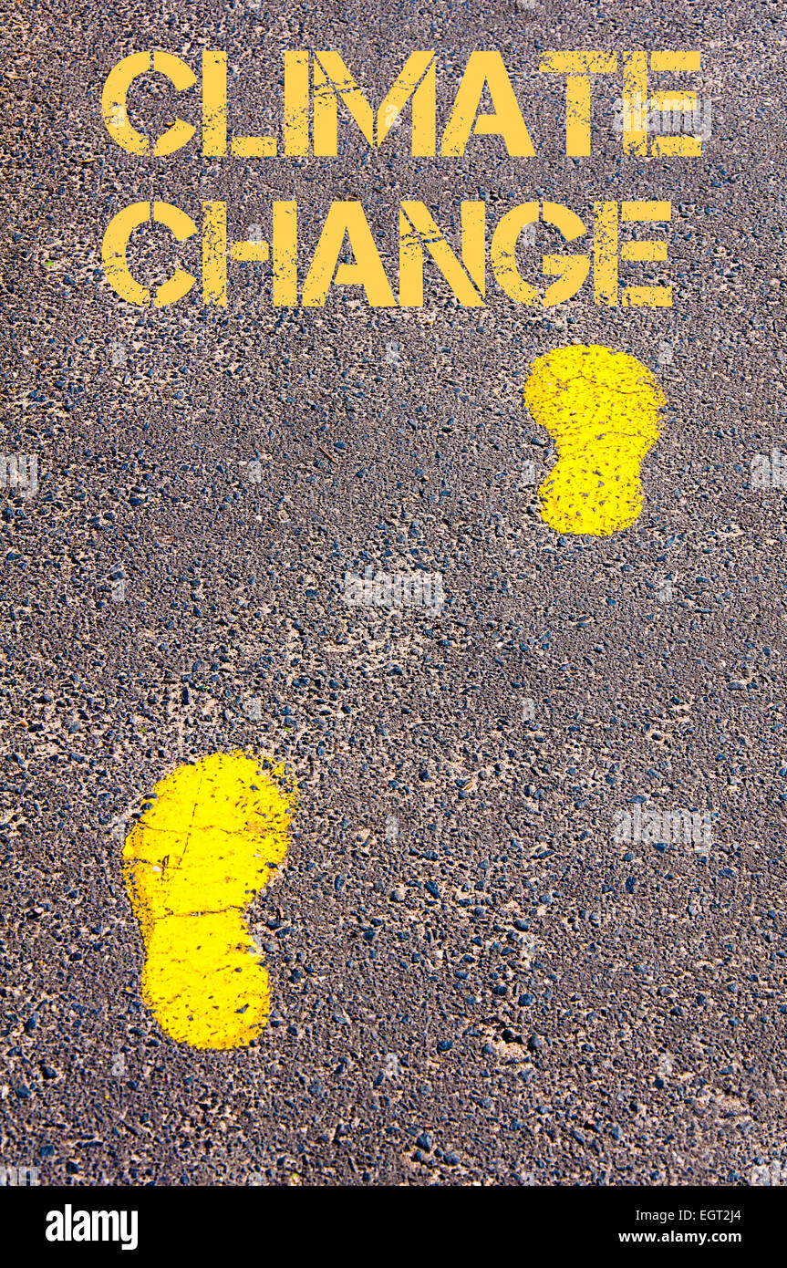 Yellow footsteps on sidewalk towards Climate Change message.Conceptual ...