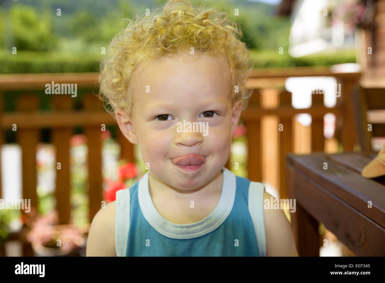 child makes a grimace and smile Stock Photo - Alamy