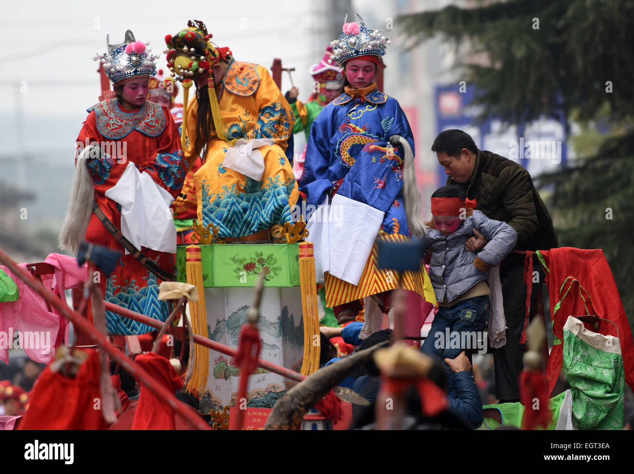 Miluo, China's Hunan Province. 2nd Mar, 2015. A man tries to hold a ...