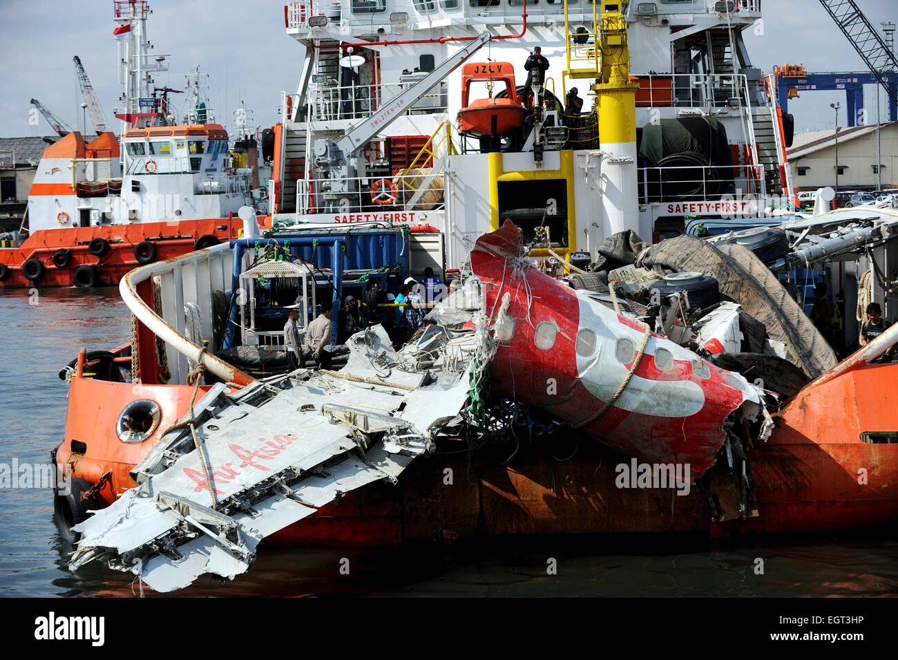 Jakarta, Indonesia. 2nd Mar, 2015. A large part of AirAsia QZ 8501 fuselage is lifted from the ...