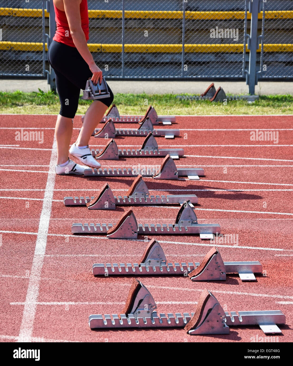 Starting machines on the running track Stock Photo - Alamy