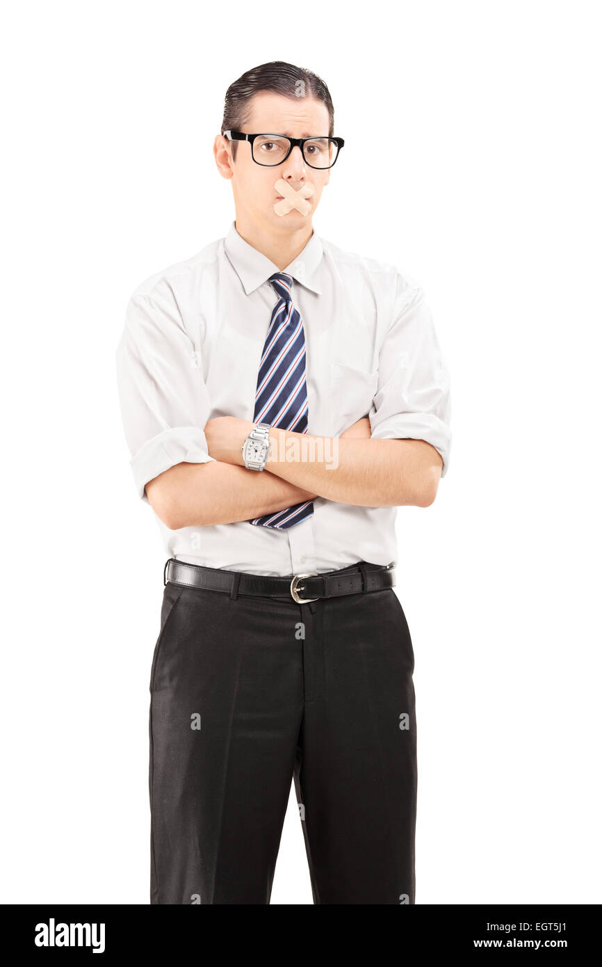 Vertical shot of a man having his mouth shut with a bandage isolated on ...