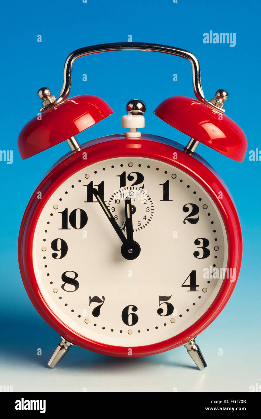 Red alarm clock Stock Photo - Alamy