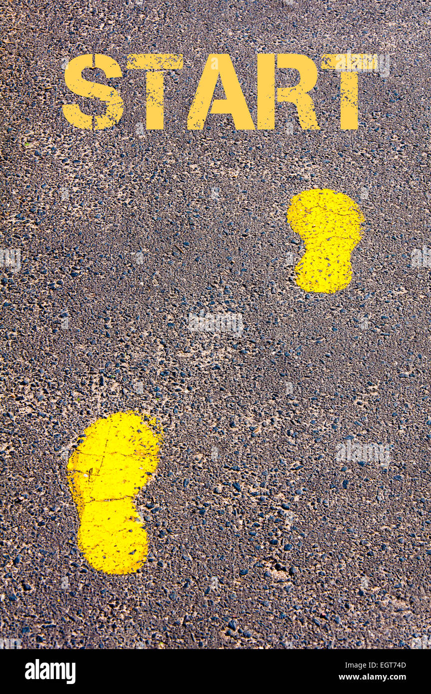 Yellow footsteps on sidewalk towards Start message.Conceptual image ...