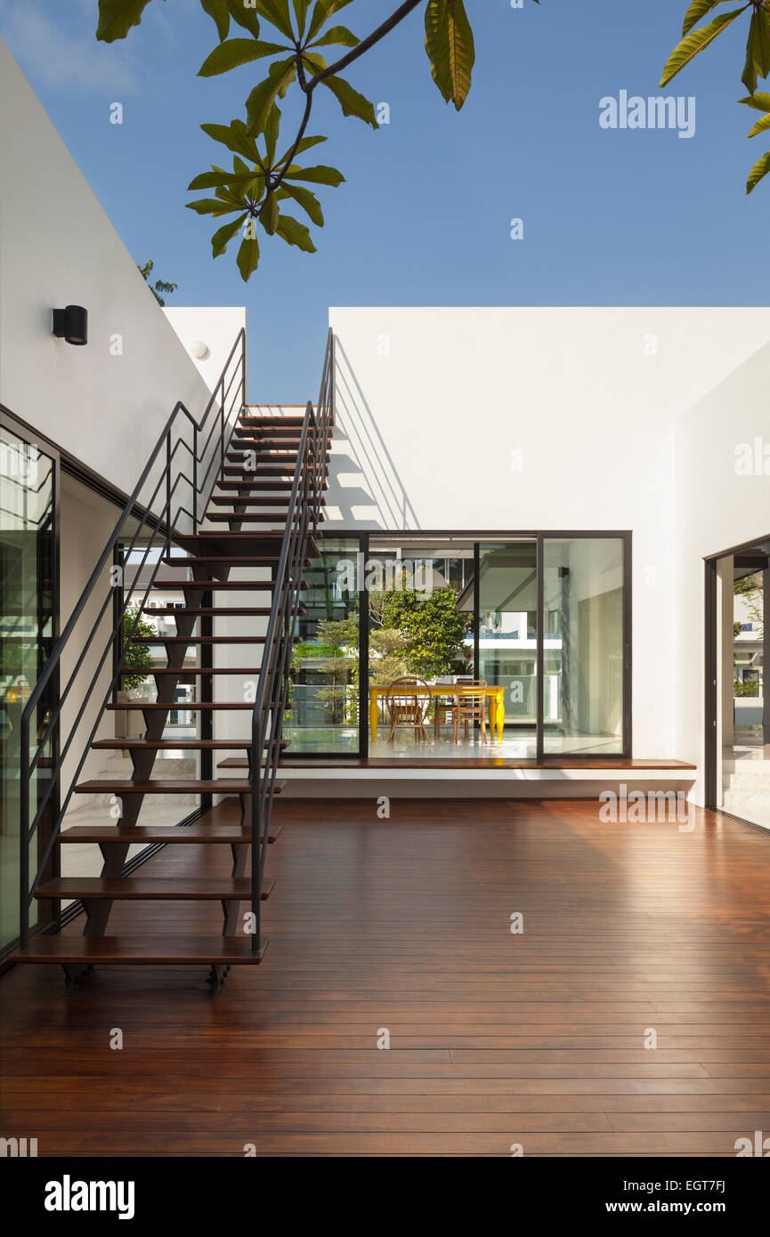 Steps access to roof terrace in Mandai Courtyard House in Singapore ...