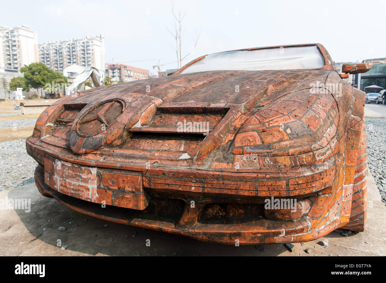 Shanghai, China. 1st March, 2015. A Benz car made of red bricks parks ...