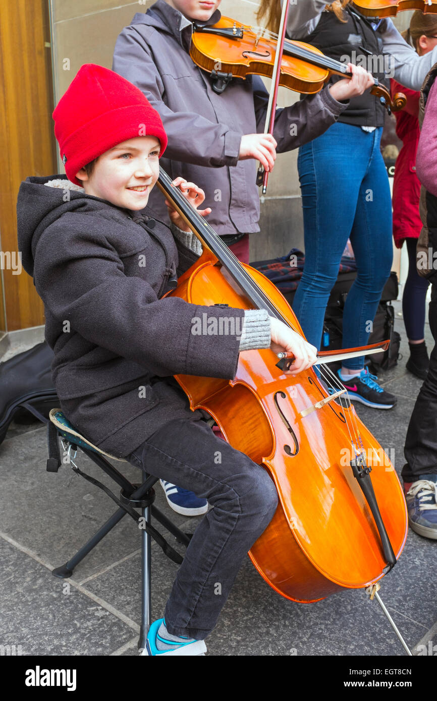 Boy playing cello hi-res stock photography and images - Alamy