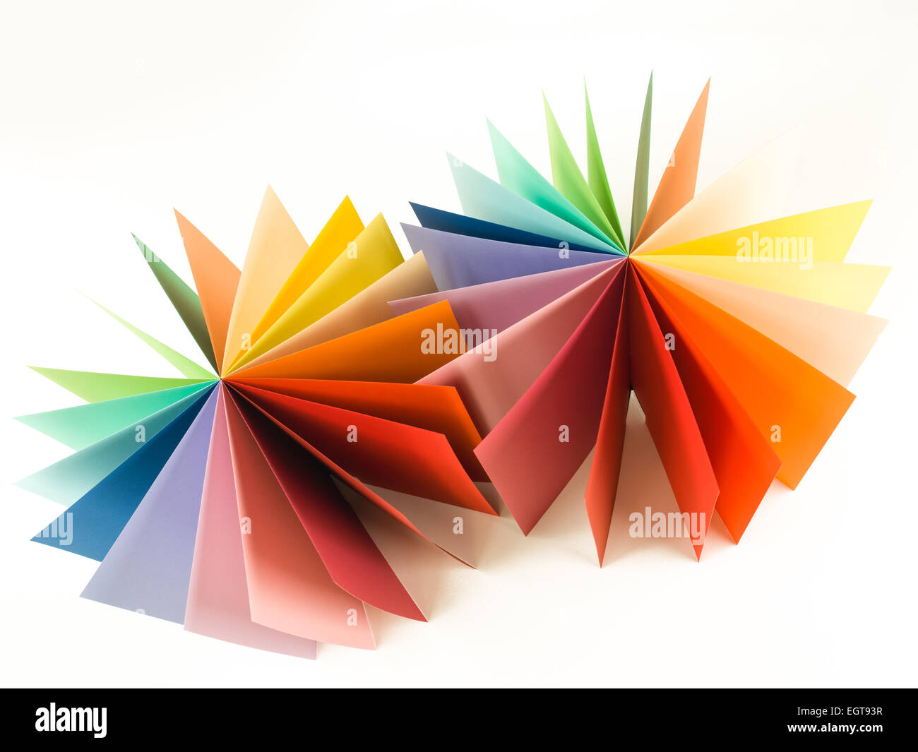 two colorful paper cylinder fan shape on white background Stock Photo ...