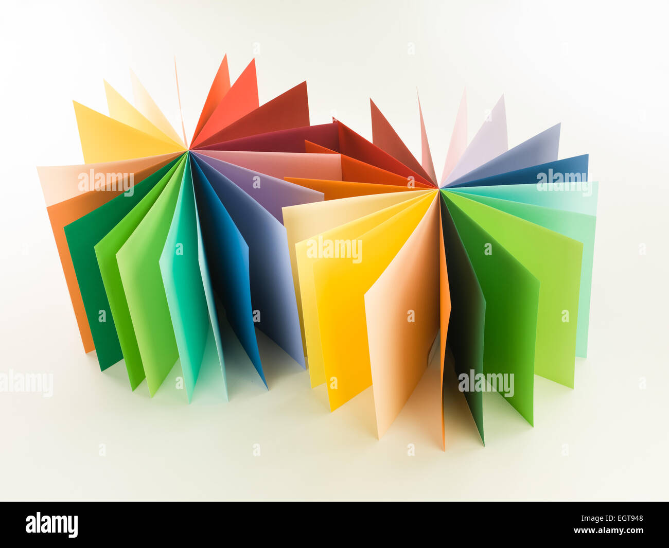 perspective view of colorful origami paper spread out in fan shape ...