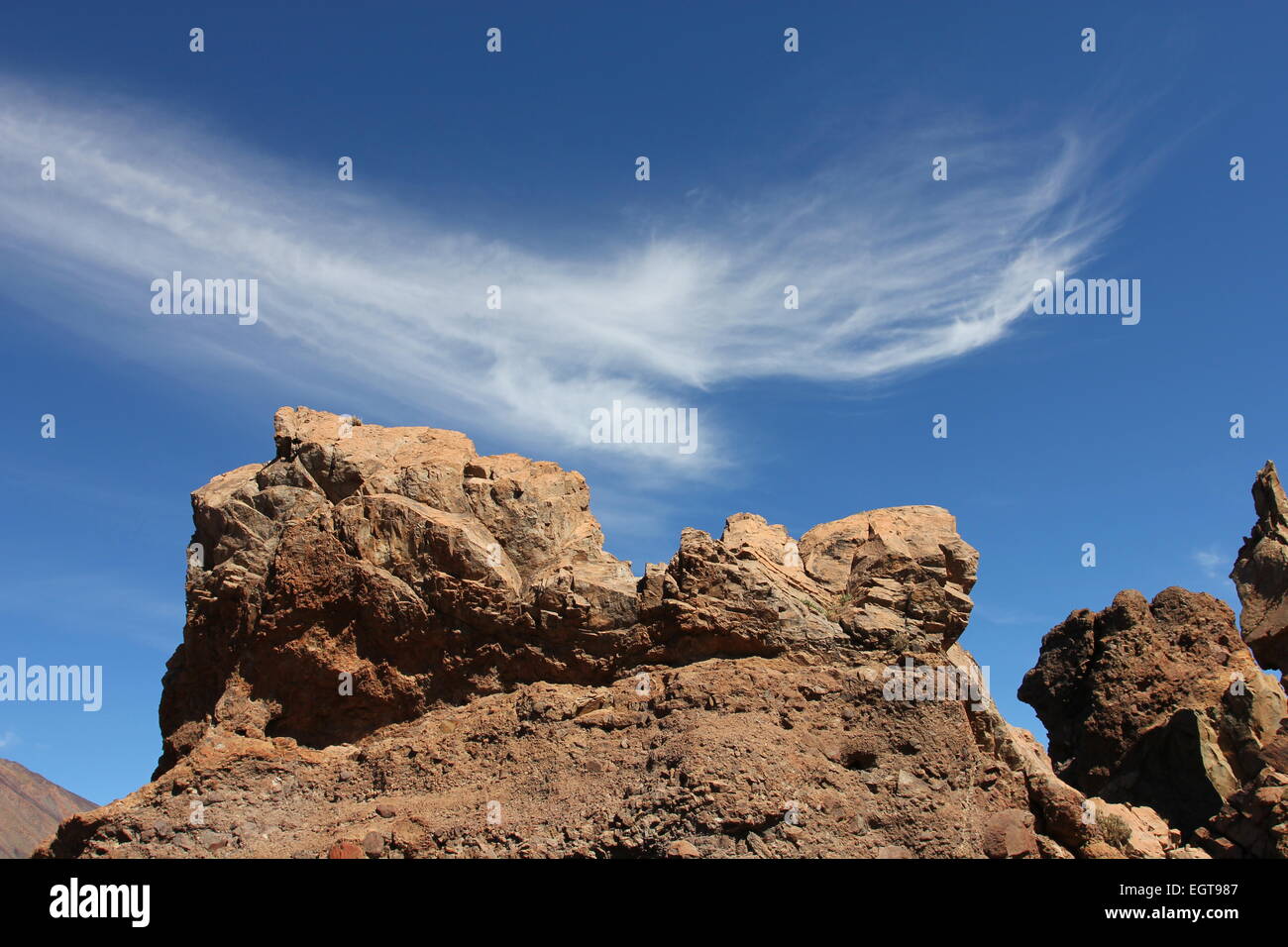 spiky jagged rocks blue sky wispy cloud Rocky castles teide national ...