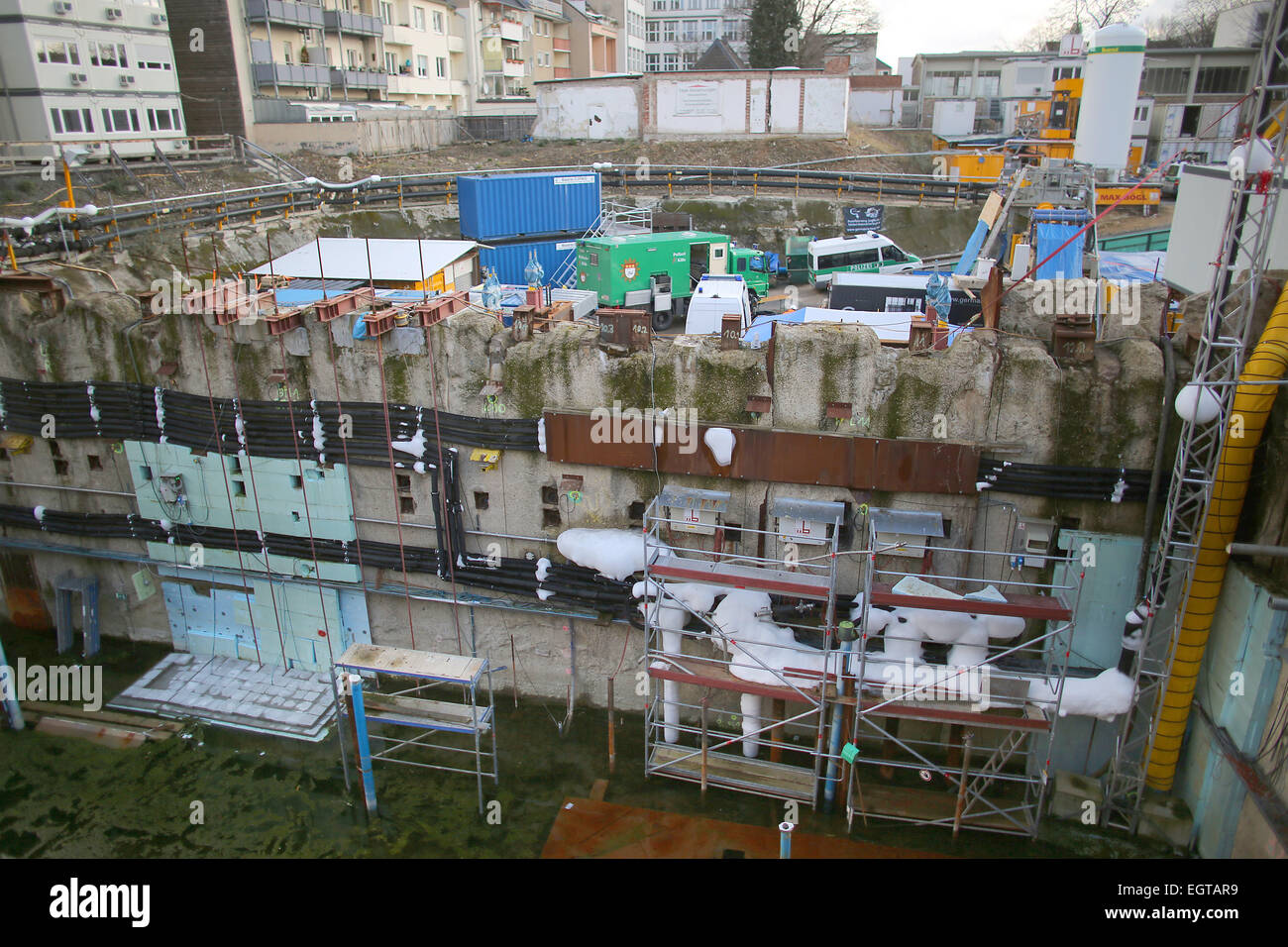 Police officers and engineers work on the sight of the collapse of the ...