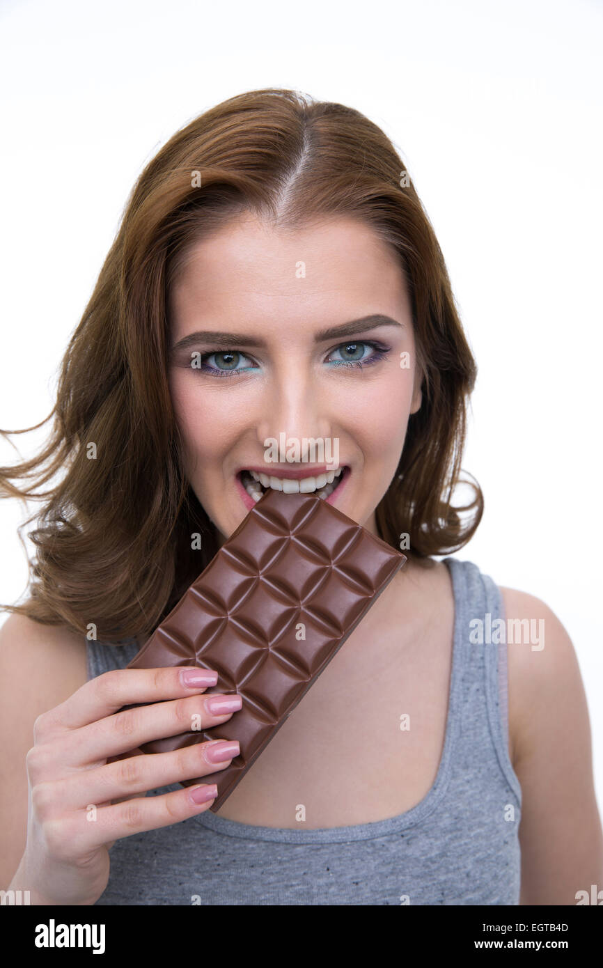 Young woman biting into chocolate bar hi-res stock photography and ...