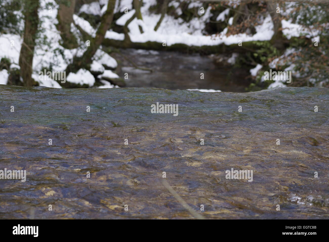 Into the deep! overlooking a small waterfall on welsh stream, winters ...