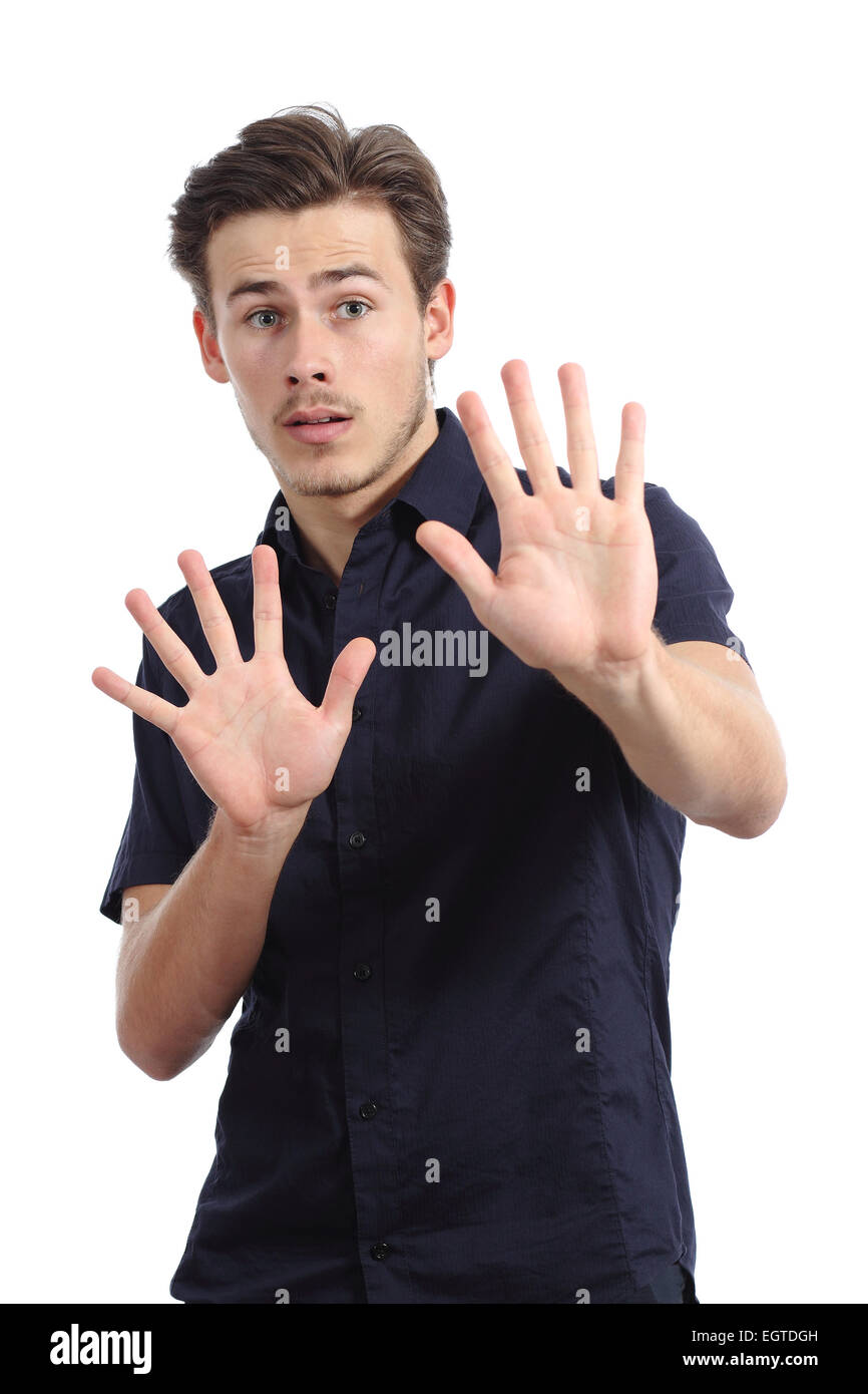 Afraid man in defense attitude gesturing stop with hands isolated on a ...