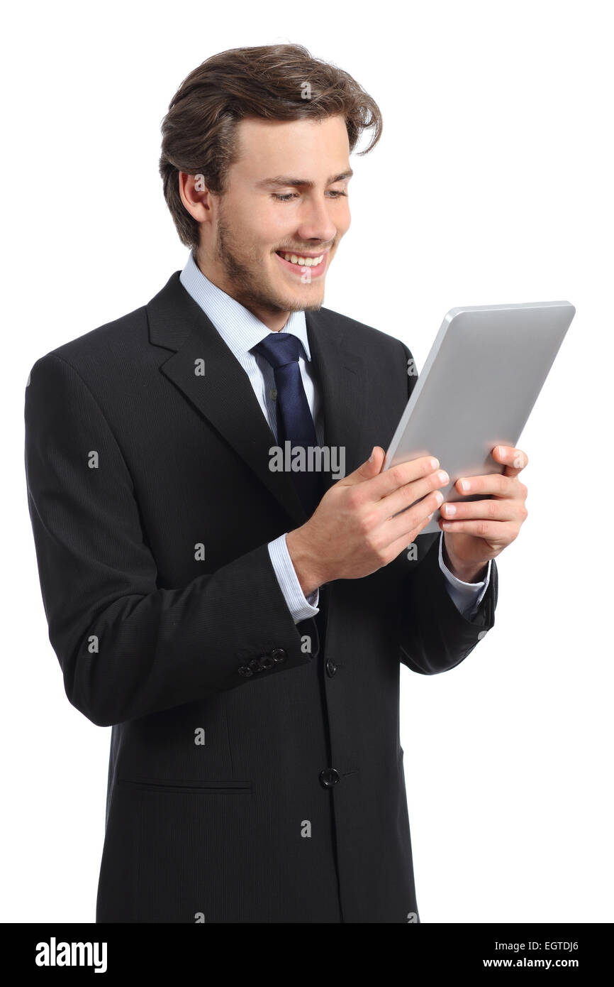 Happy young business man reading a tablet reader isolated on a white ...