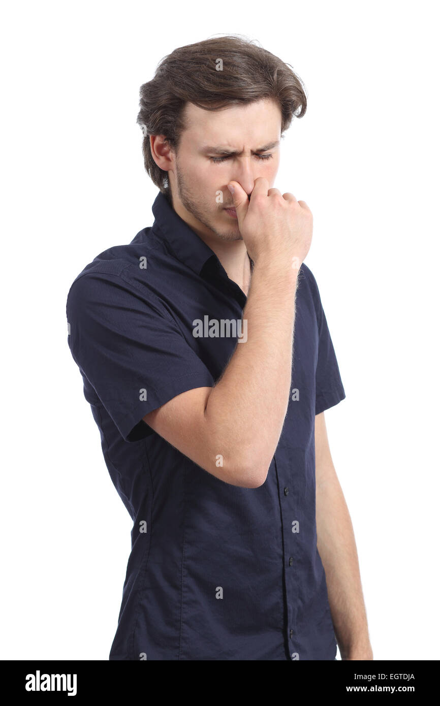 Man holding his nose smelling stink isolated on a white background ...