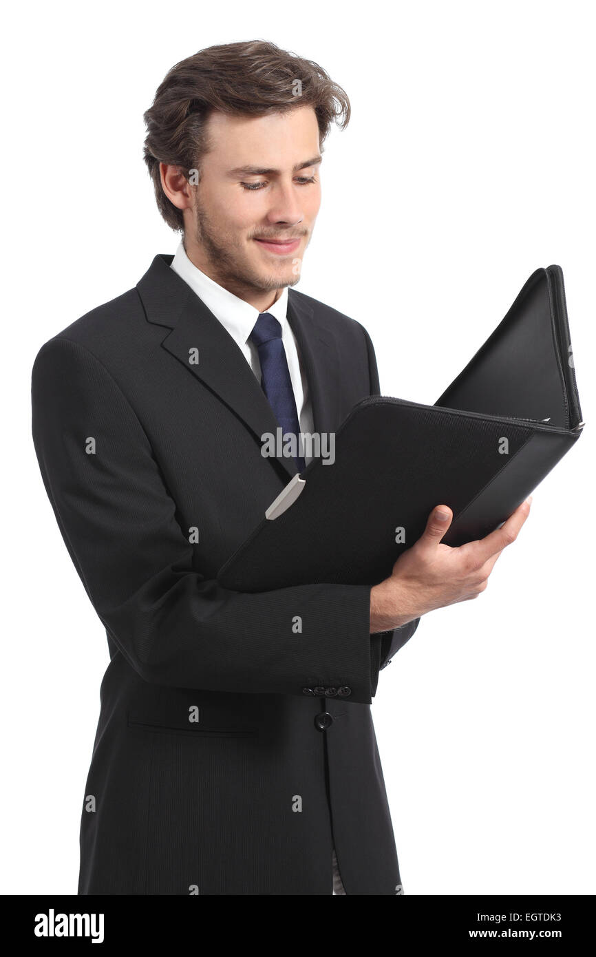 Young businessman reading a report isolated on a white background Stock ...