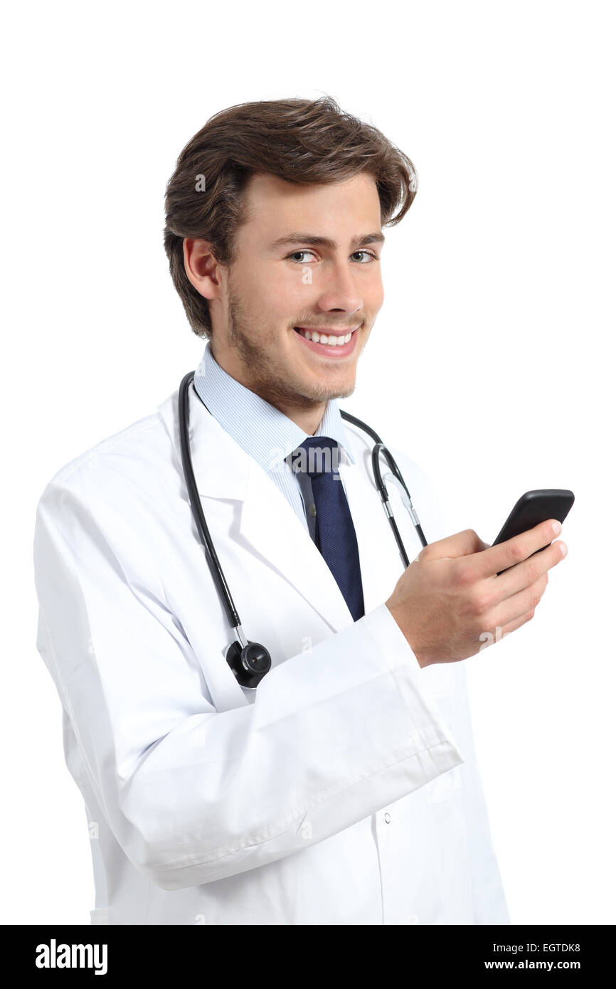 Young happy doctor holding a smart phone isolated on a white background ...