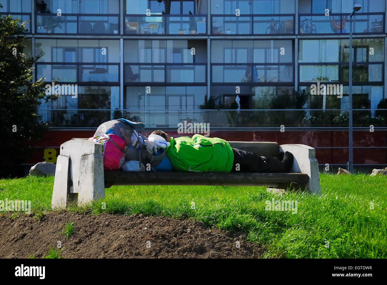 Vienna, Austria. A homeless sleeping on a bench Stock Photo - Alamy