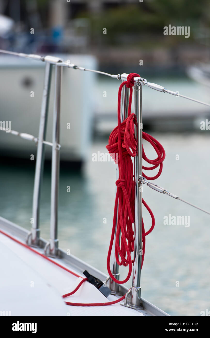 A red rope tied around a lifeline. Vertical shot Stock Photo - Alamy