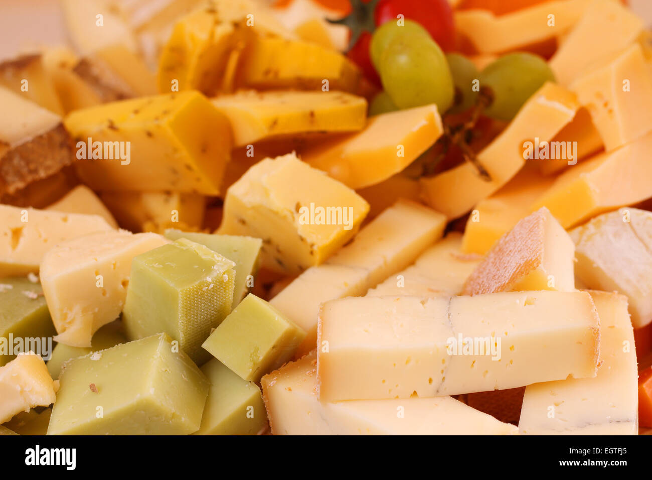 Cut french cheese blocks background close-up Stock Photo - Alamy
