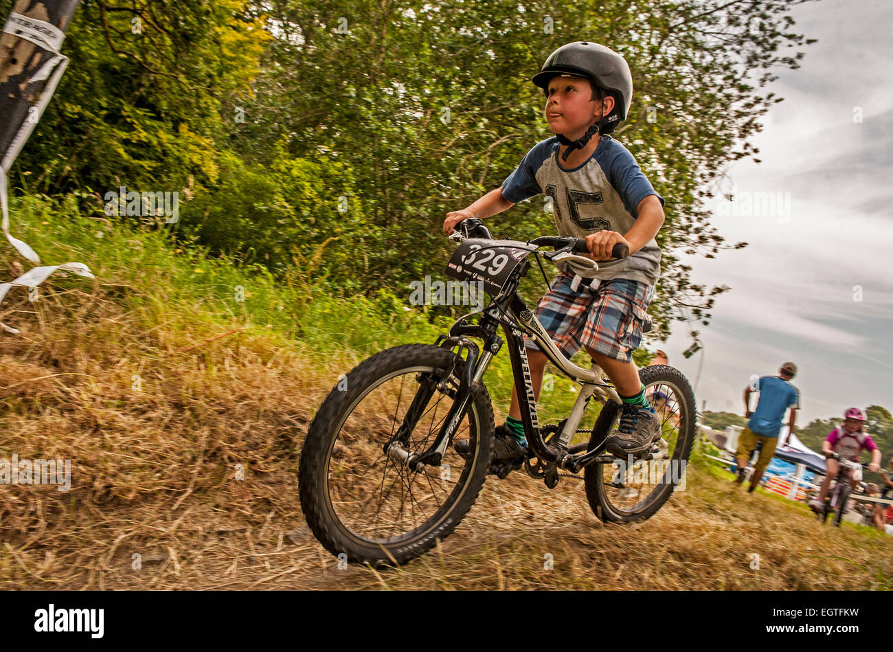Mountain biking boys riding woodland trails in Cornwall UK Stock Photo ...