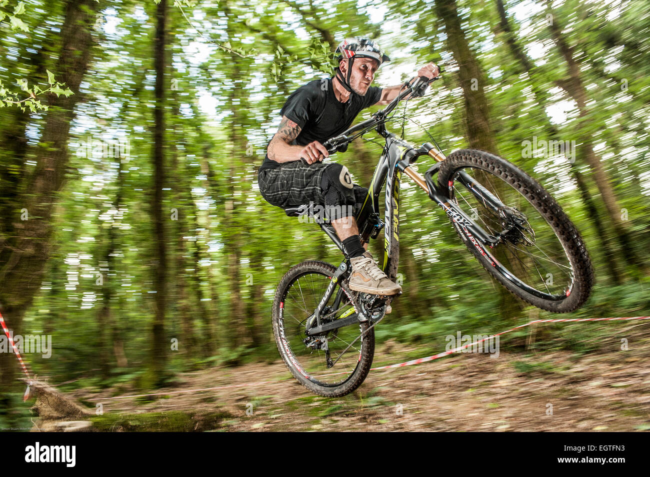 Mountain biking boys riding woodland trails in Cornwall UK Stock Photo ...