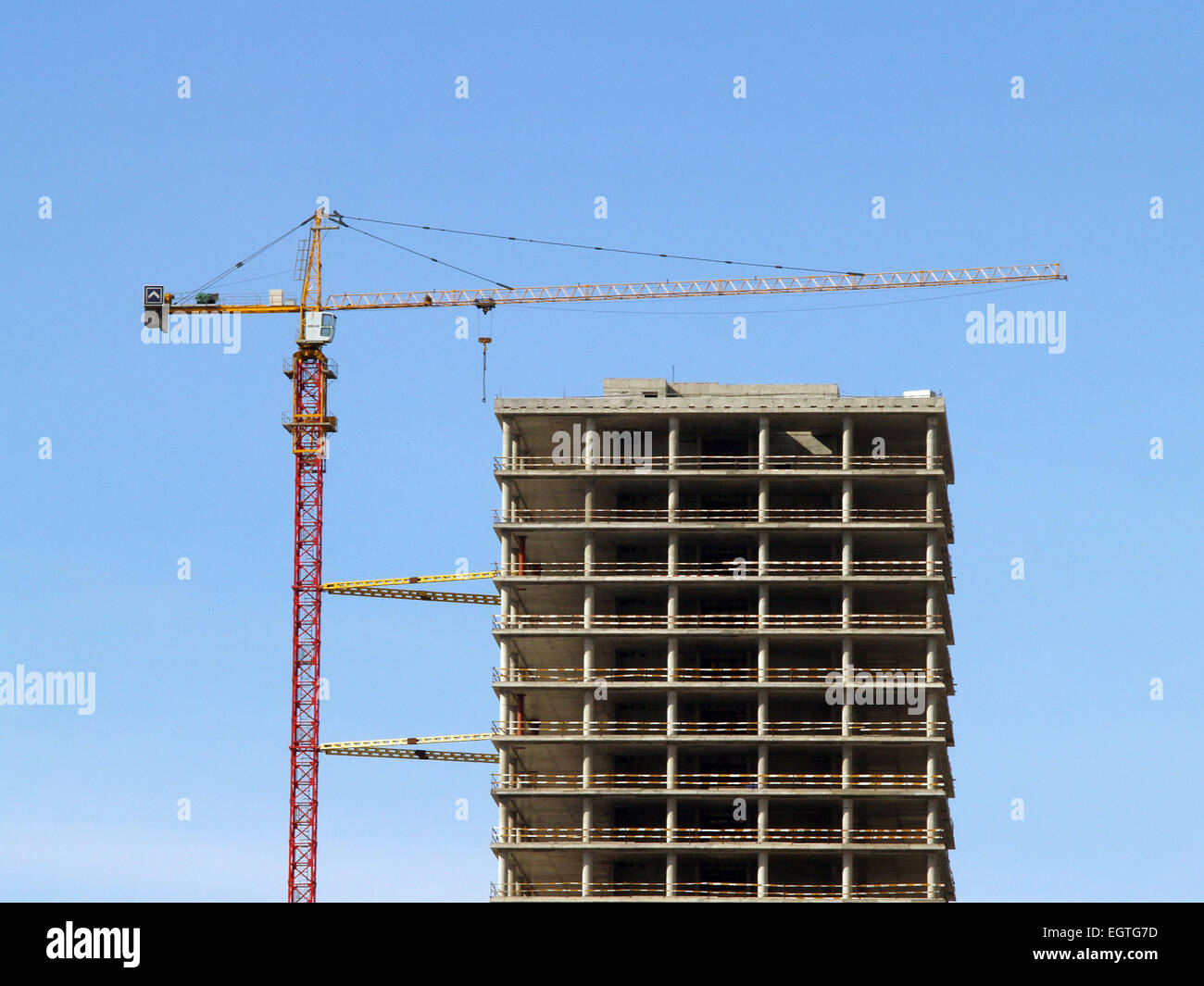 Horizontal photograph of crane and construction of a building Stock ...