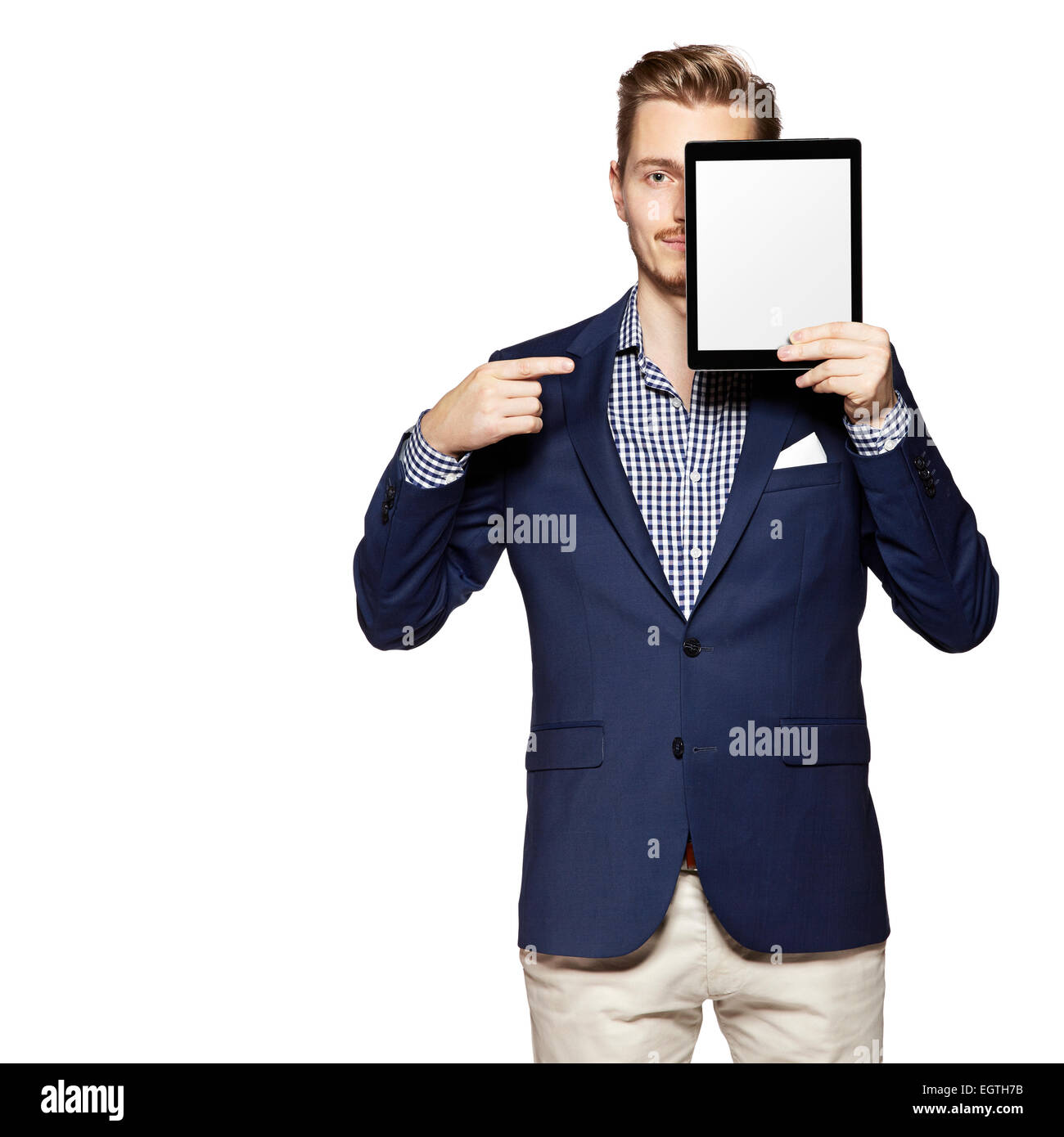 Portrait of a cheerful young man is showing something on digital tablet ...