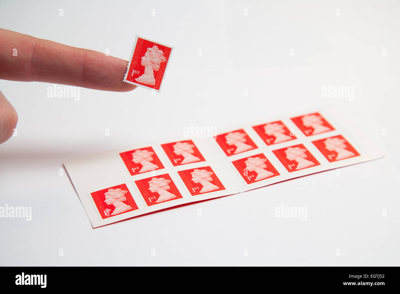 A book of UK First 1st Class stamps Stock Photo - Alamy