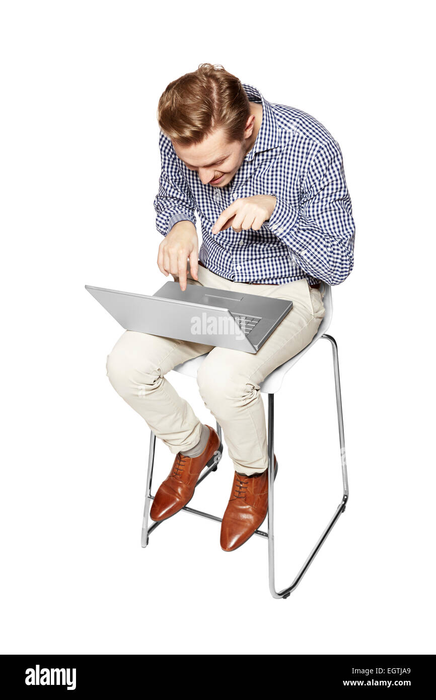 Young man leaning over the keyboard. Isolated on white background Stock ...