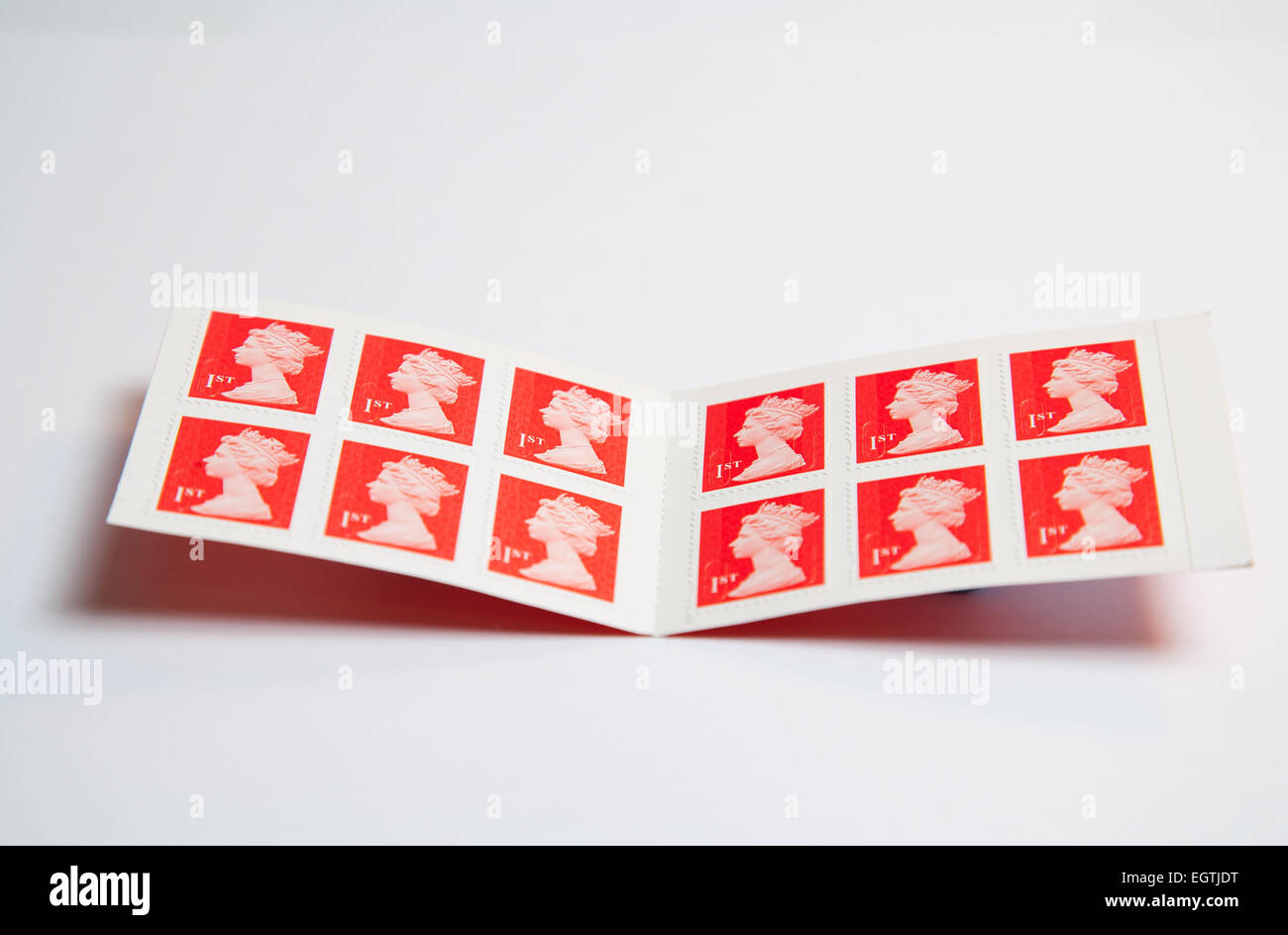A book of UK First 1st Class stamps Stock Photo - Alamy