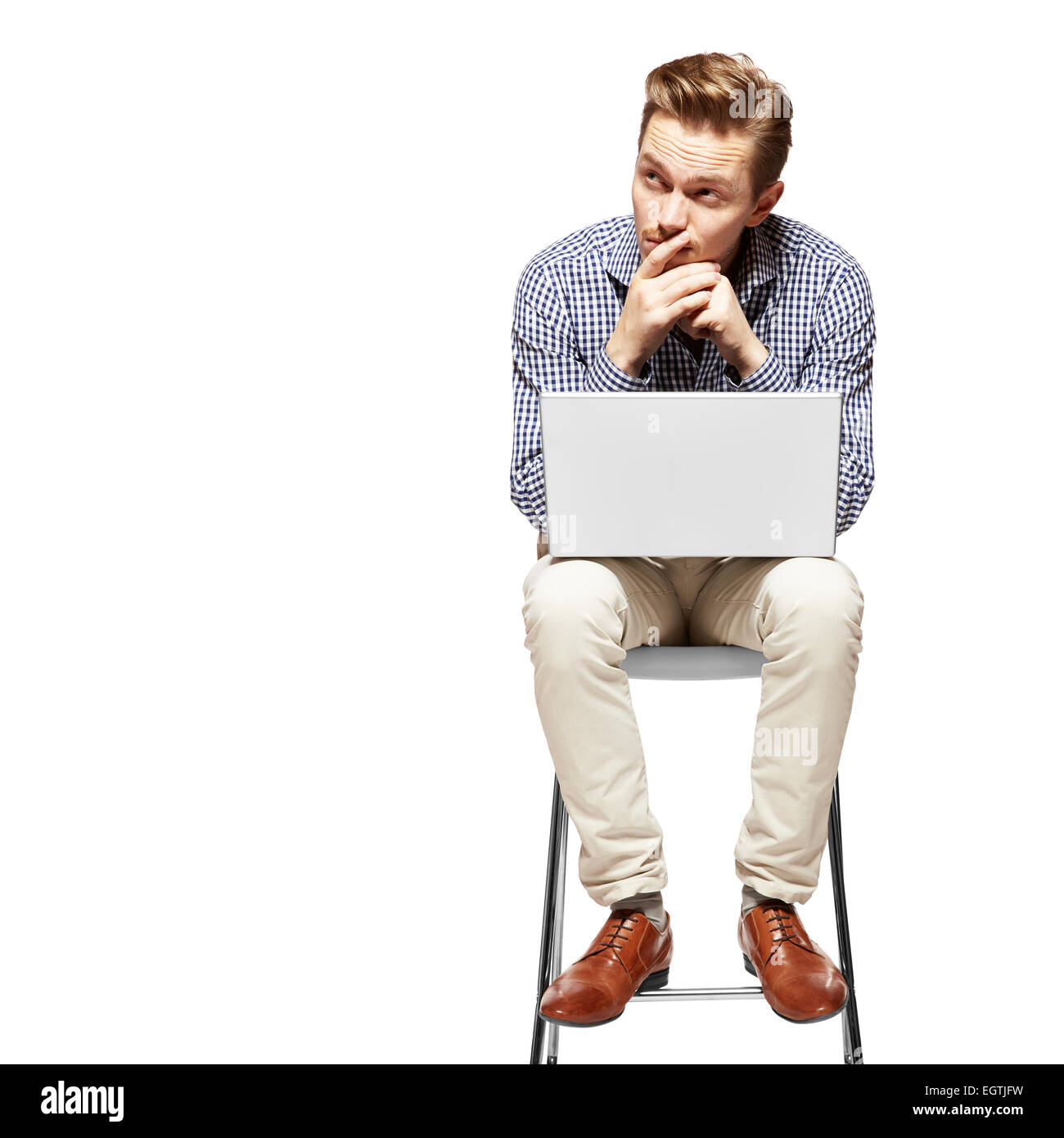 Young man working on a computer and thinking. Facial Expression Stock ...