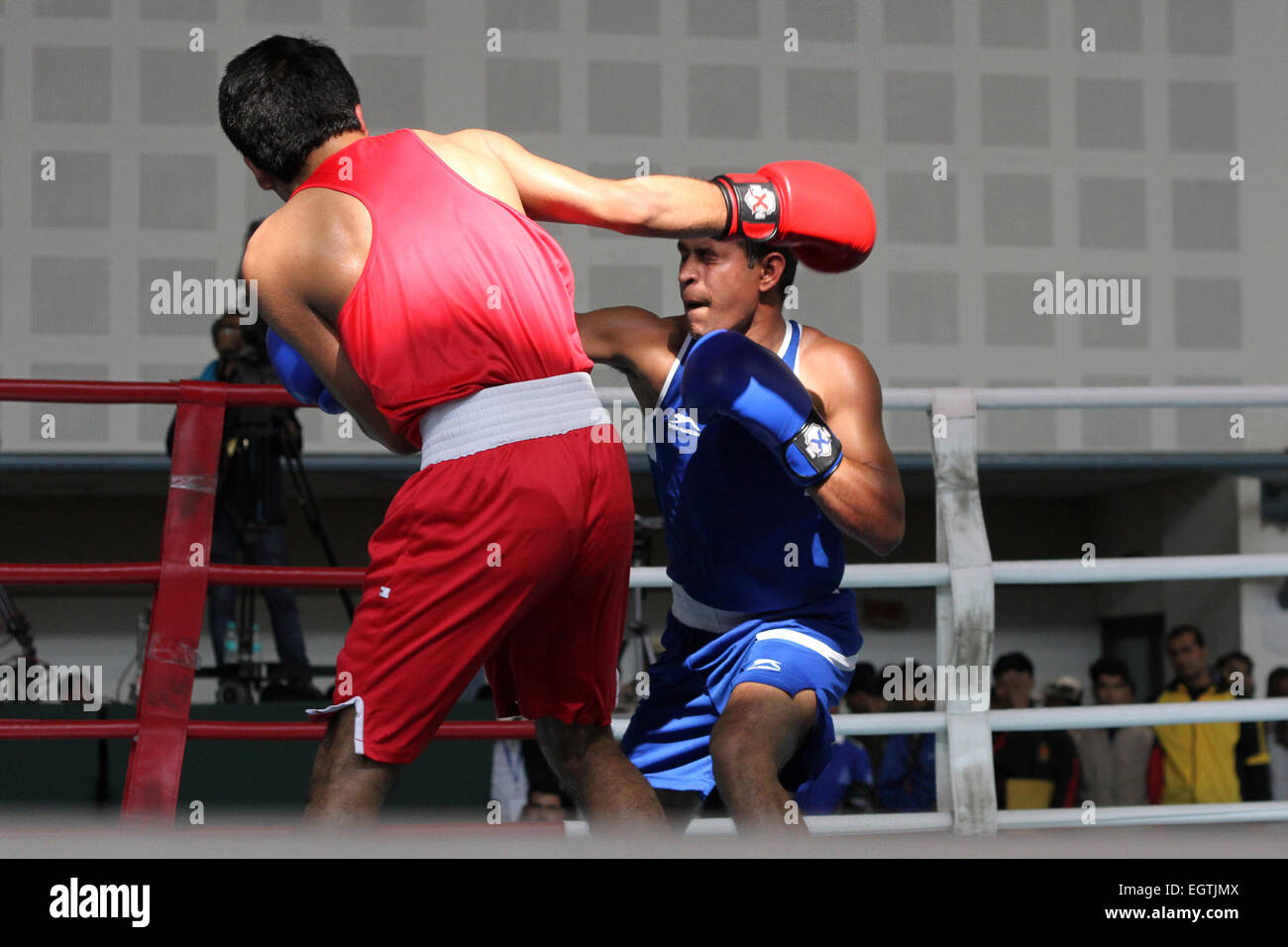 Boxer from J&K (red) in action against the RPF (blue) during the Men ...