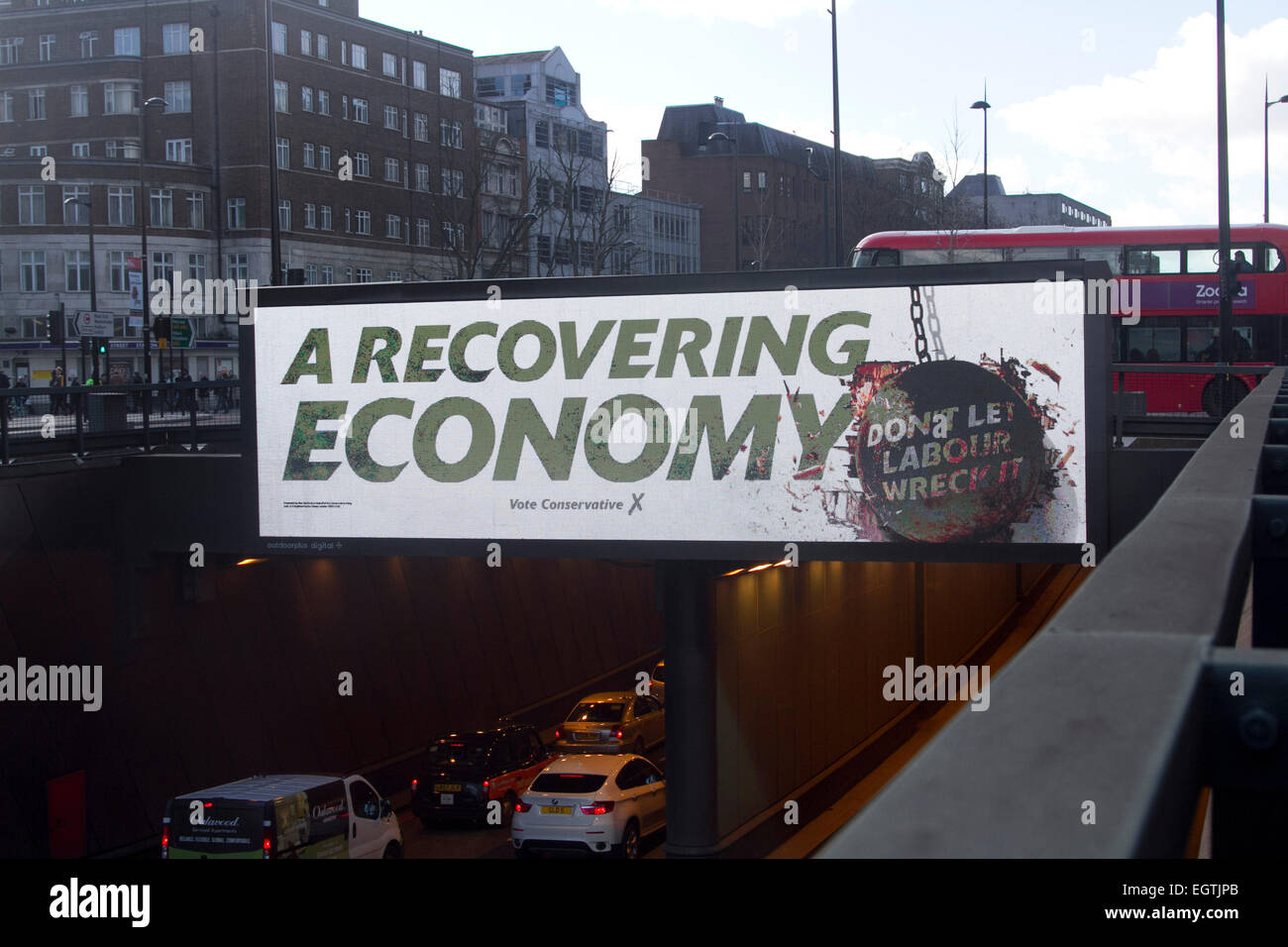 London, UK. 2nd March, 2015. An electronic board flashes a campaign ...