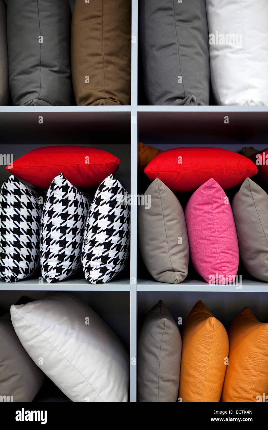 Decorating with colorful cushions on wooden shelves Stock Photo - Alamy