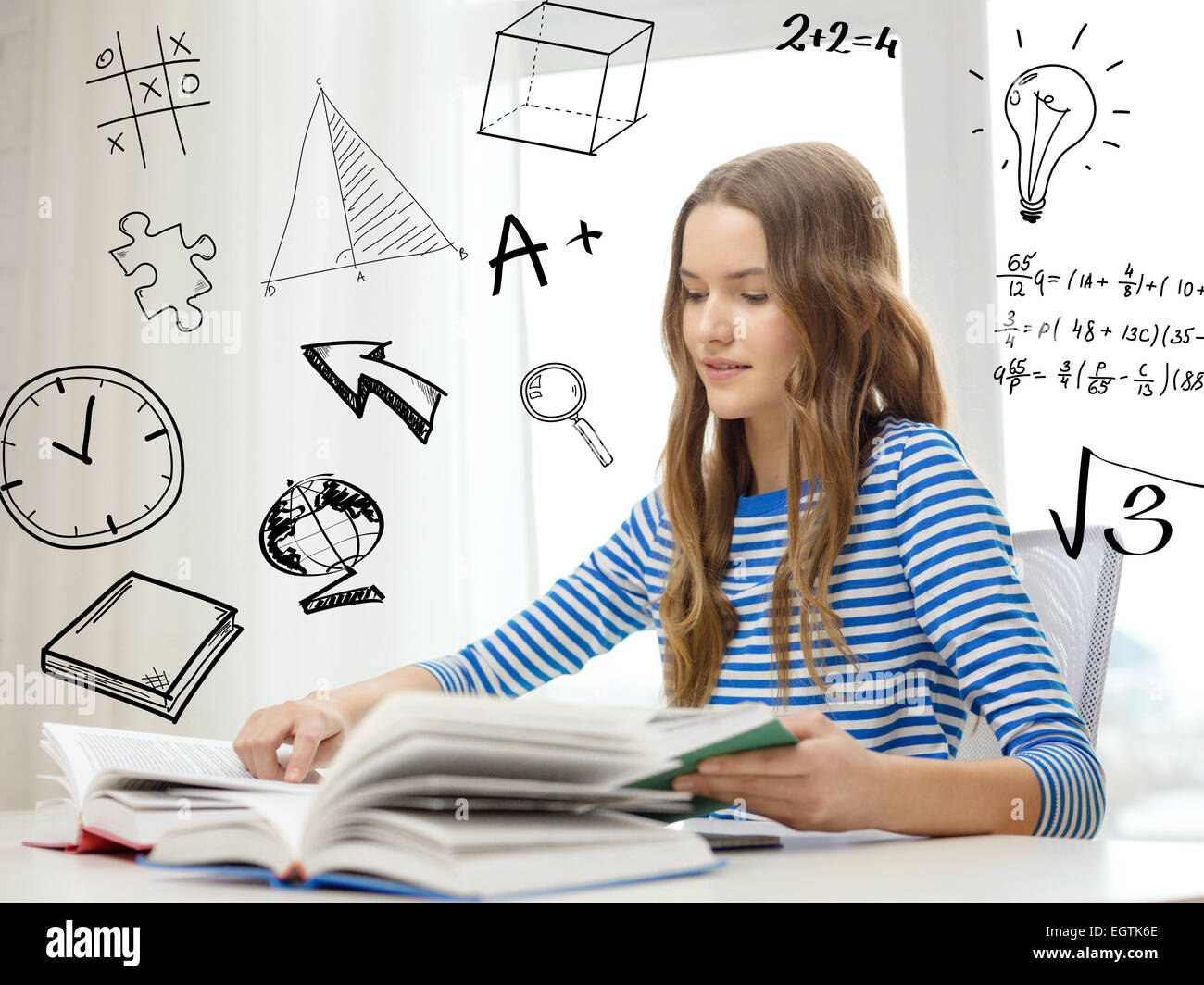 smiling student girl reading books at home Stock Photo - Alamy