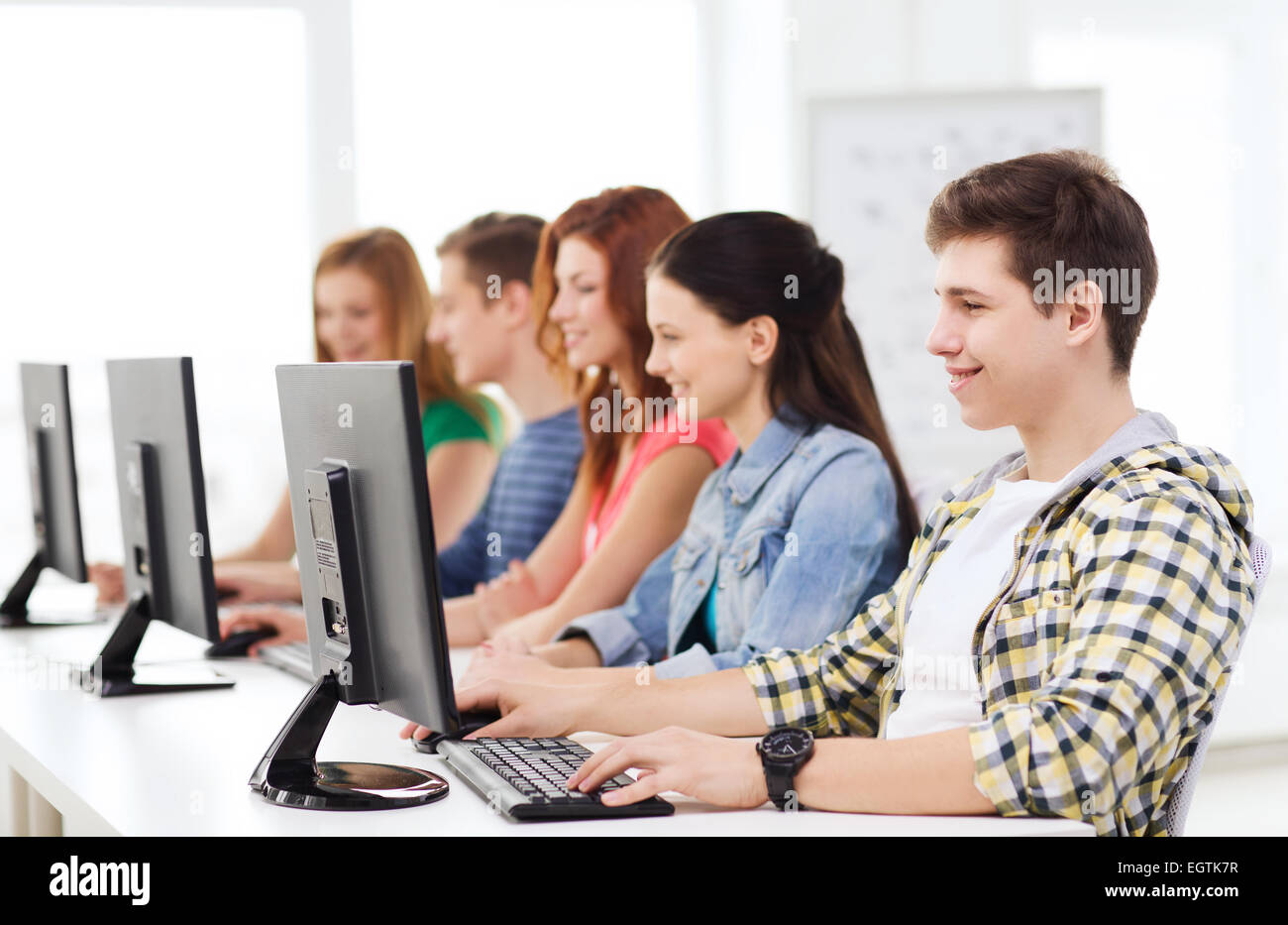 male student with classmates in computer class Stock Photo - Alamy