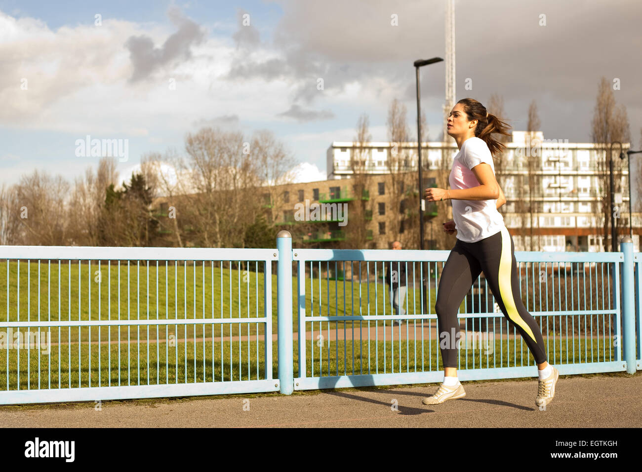 young woman running Stock Photo - Alamy