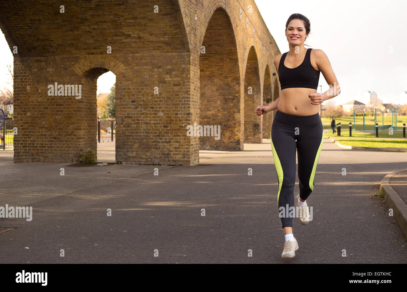 young woman running Stock Photo - Alamy