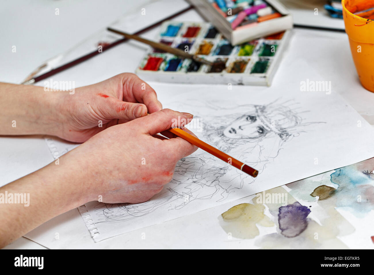 The artist paints a picture to pencil sketches. Art background Stock ...