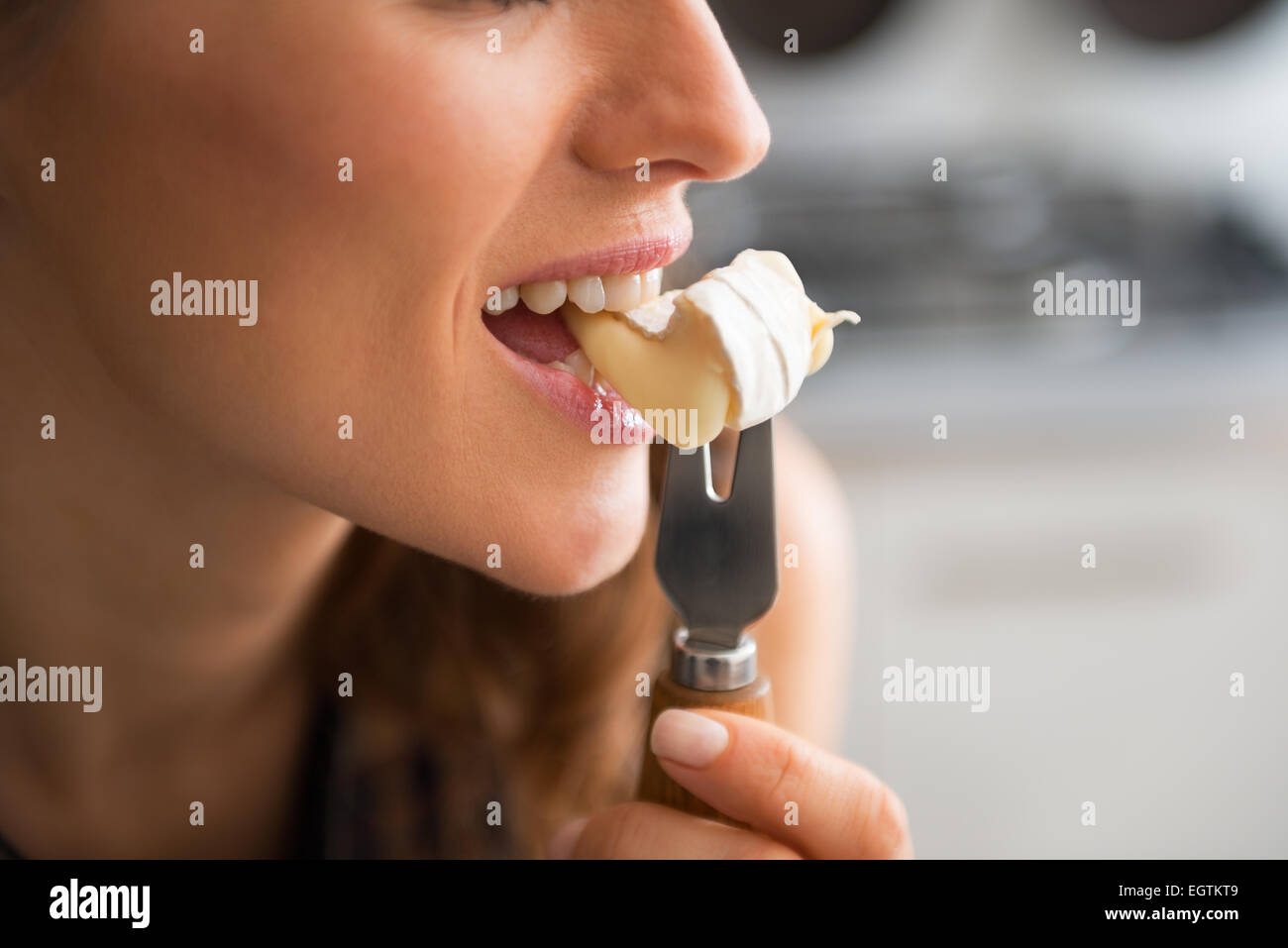 Woman eating camembert hi-res stock photography and images - Alamy