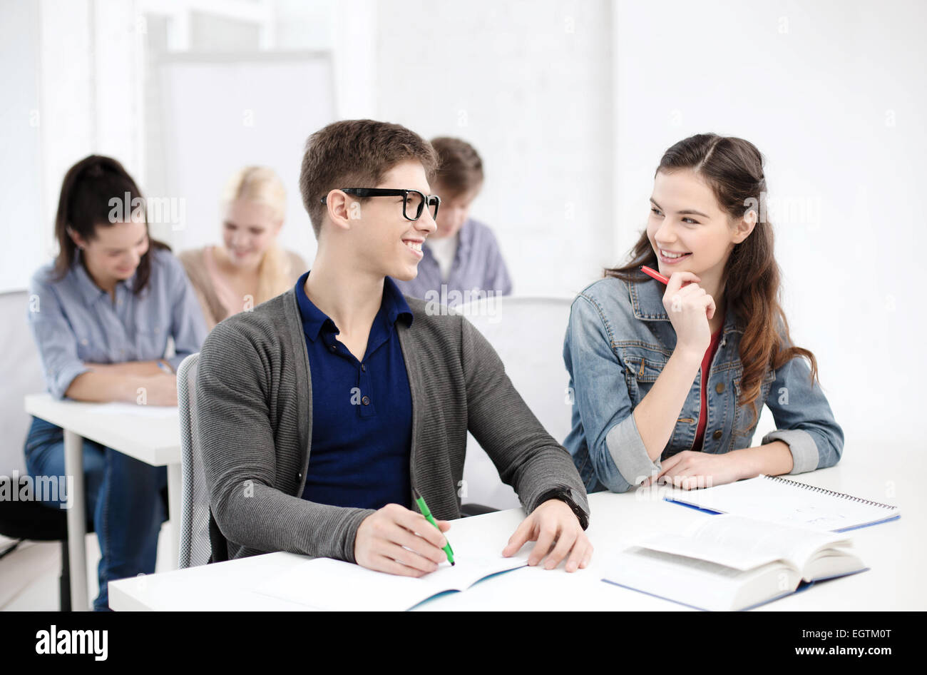 smiling students with notebooks at school Stock Photo - Alamy