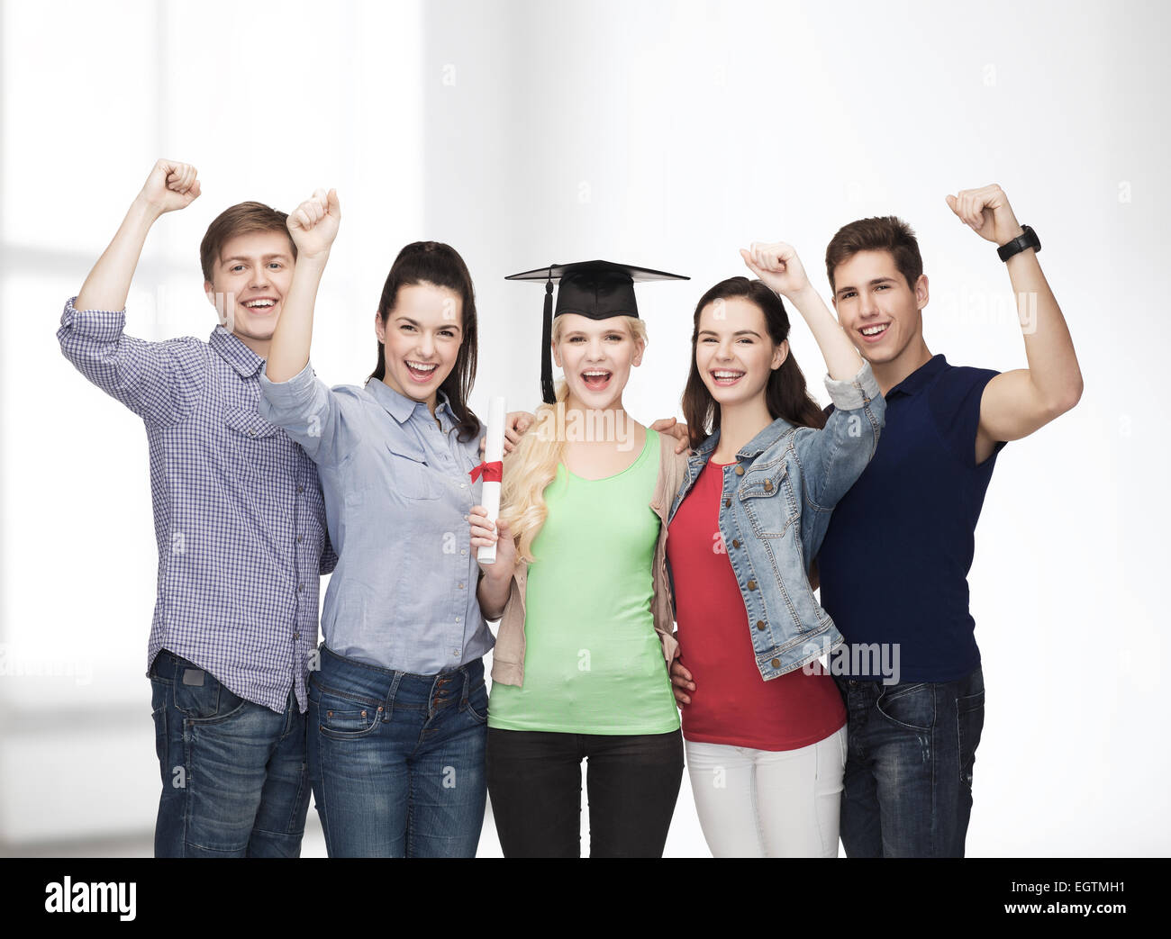 group of standing smiling students with diploma Stock Photo - Alamy
