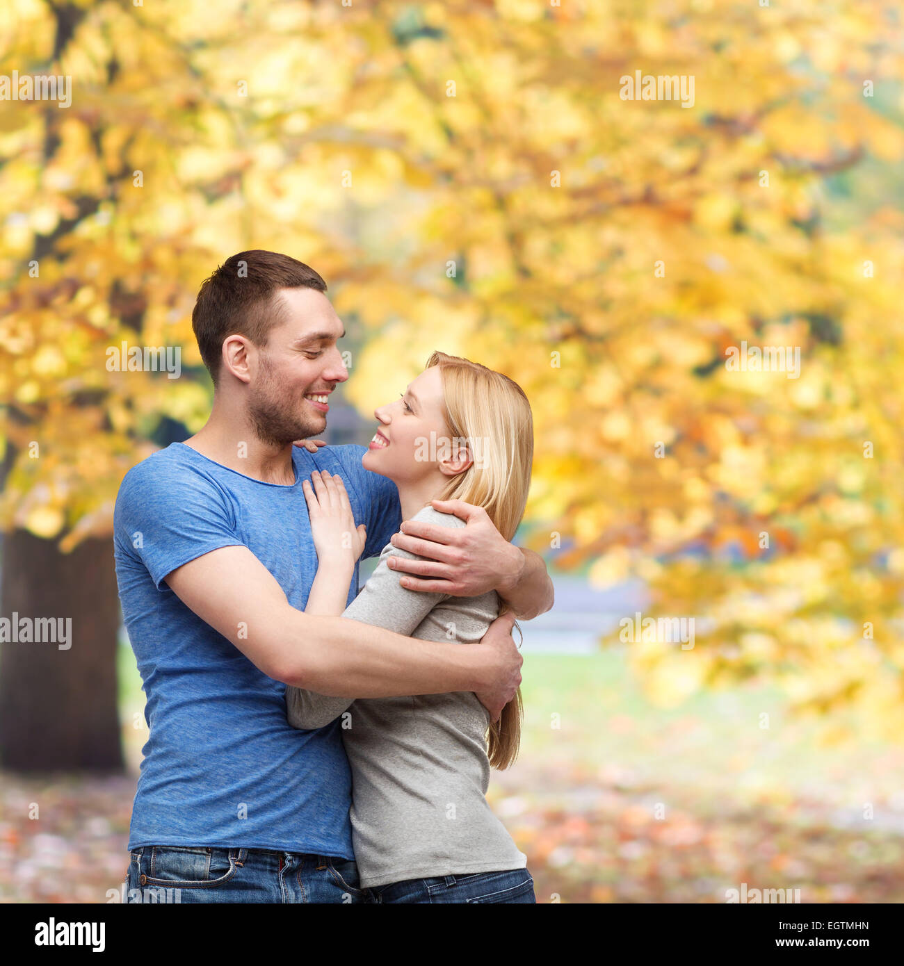 Two lovers hugging each other hi-res stock photography and images - Alamy